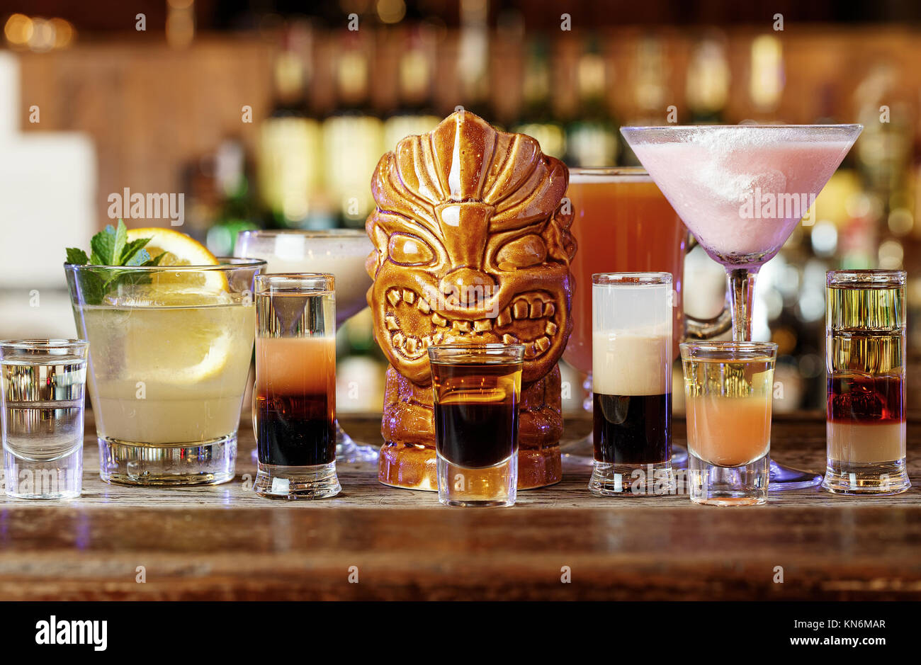 mix of cocktails in a nightclub, stand in a row on a bar counter on a ...