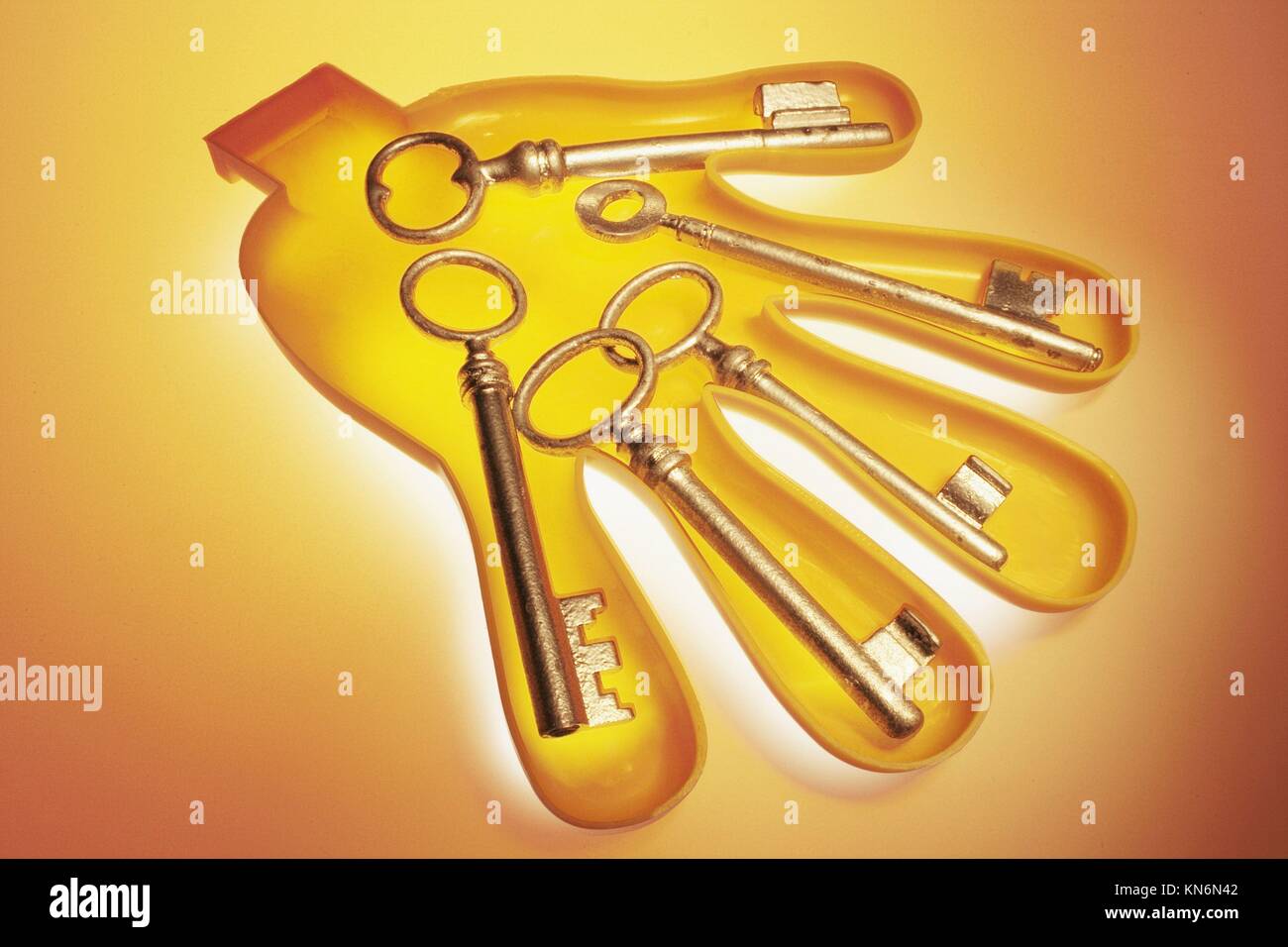 Yellow plastic hand Stock Photo - Alamy