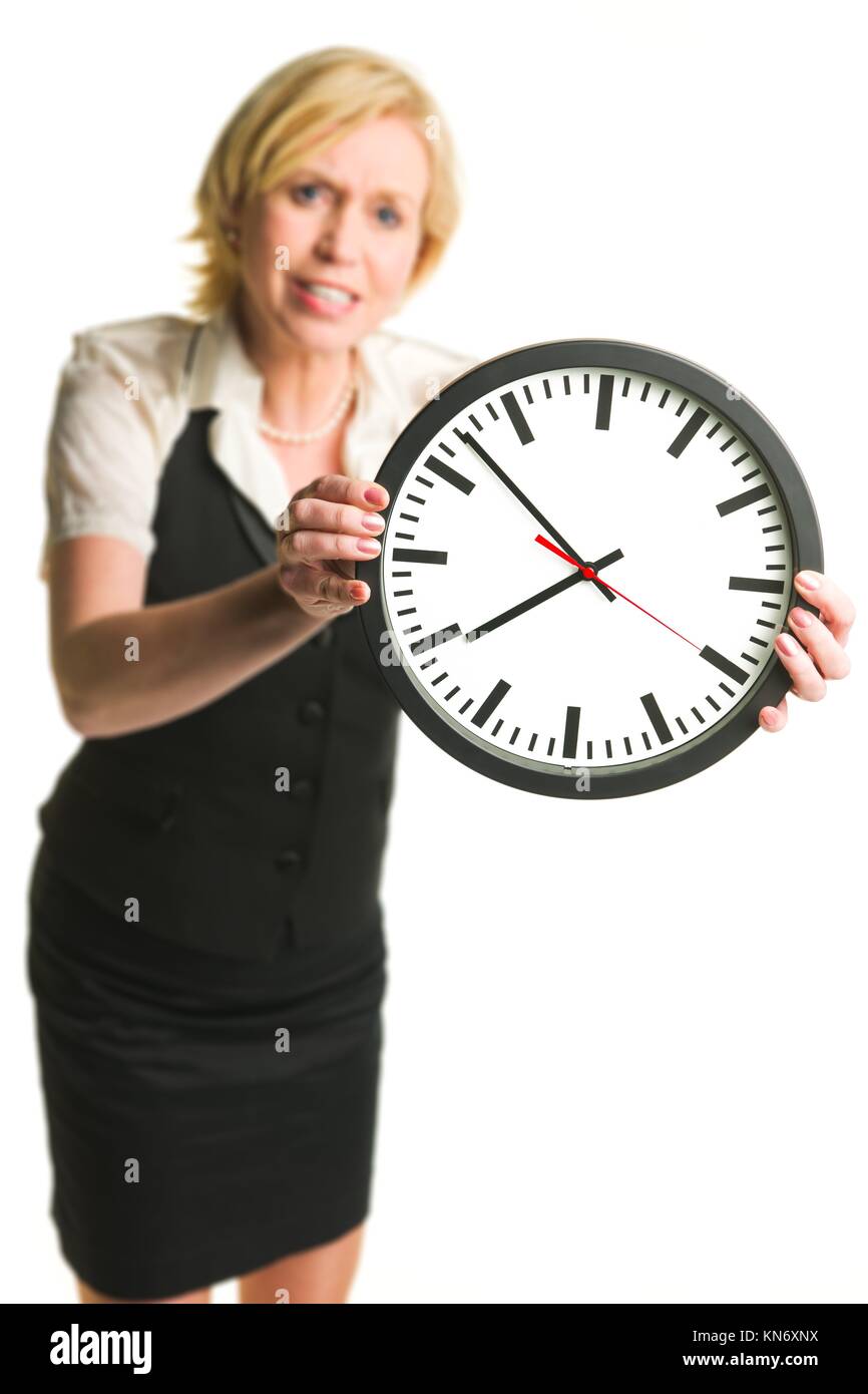 Woman holding and showing a clock, white isolated background Stock ...