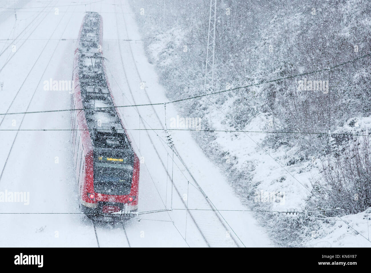 German S-Bahn suburban train in snowy weather, Mülheim an der Ruhr ...