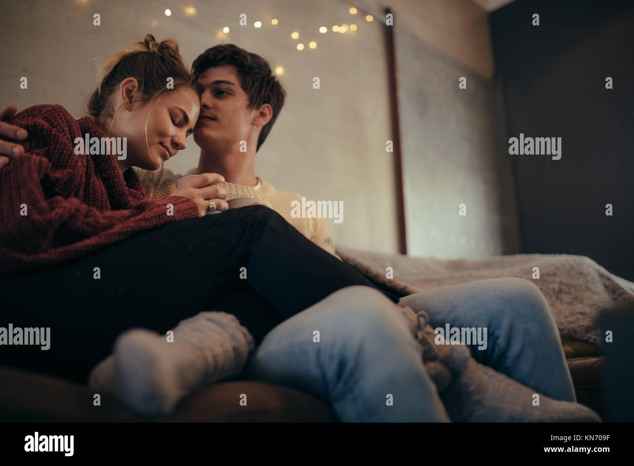 Passionate couple sofa hi-res stock photography and images - Alamy