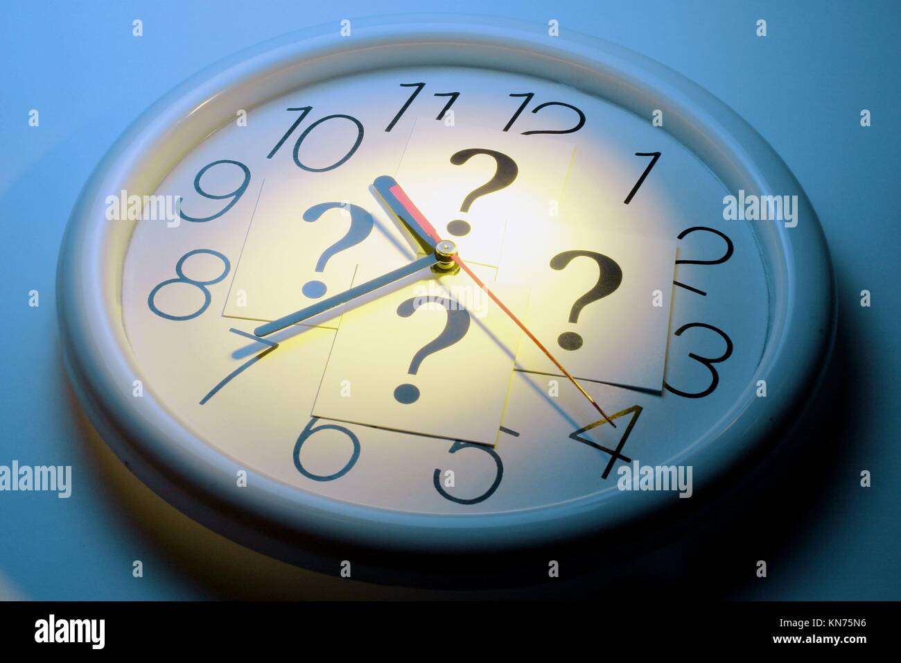 Question marks on clock Stock Photo - Alamy