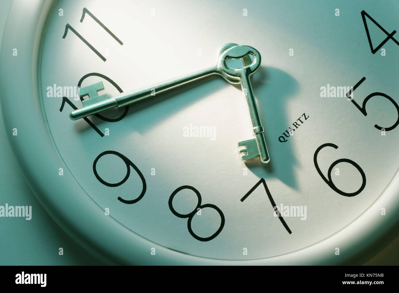 Keys on clock Stock Photo - Alamy