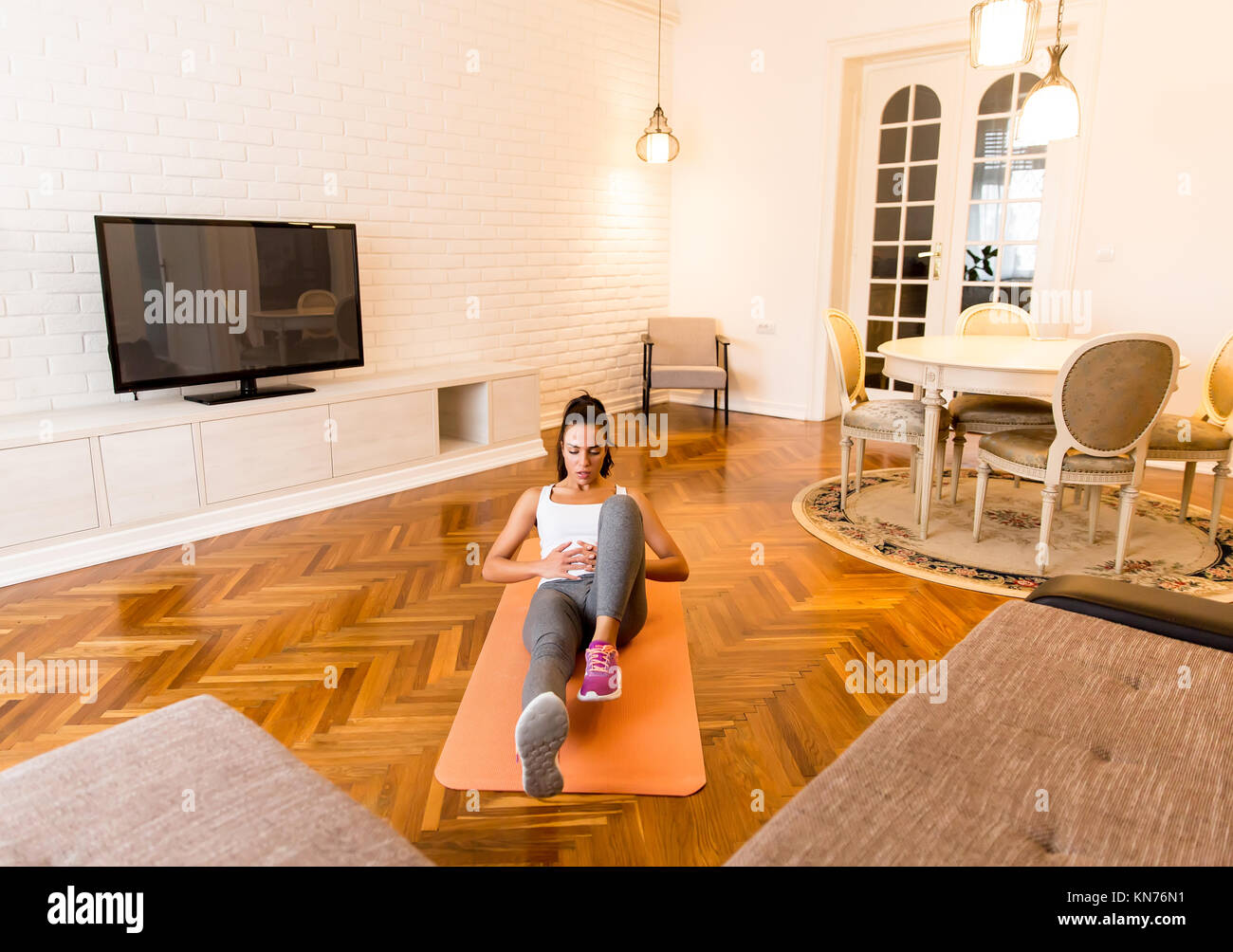 Fit woman exsercise in the room at home Stock Photo - Alamy