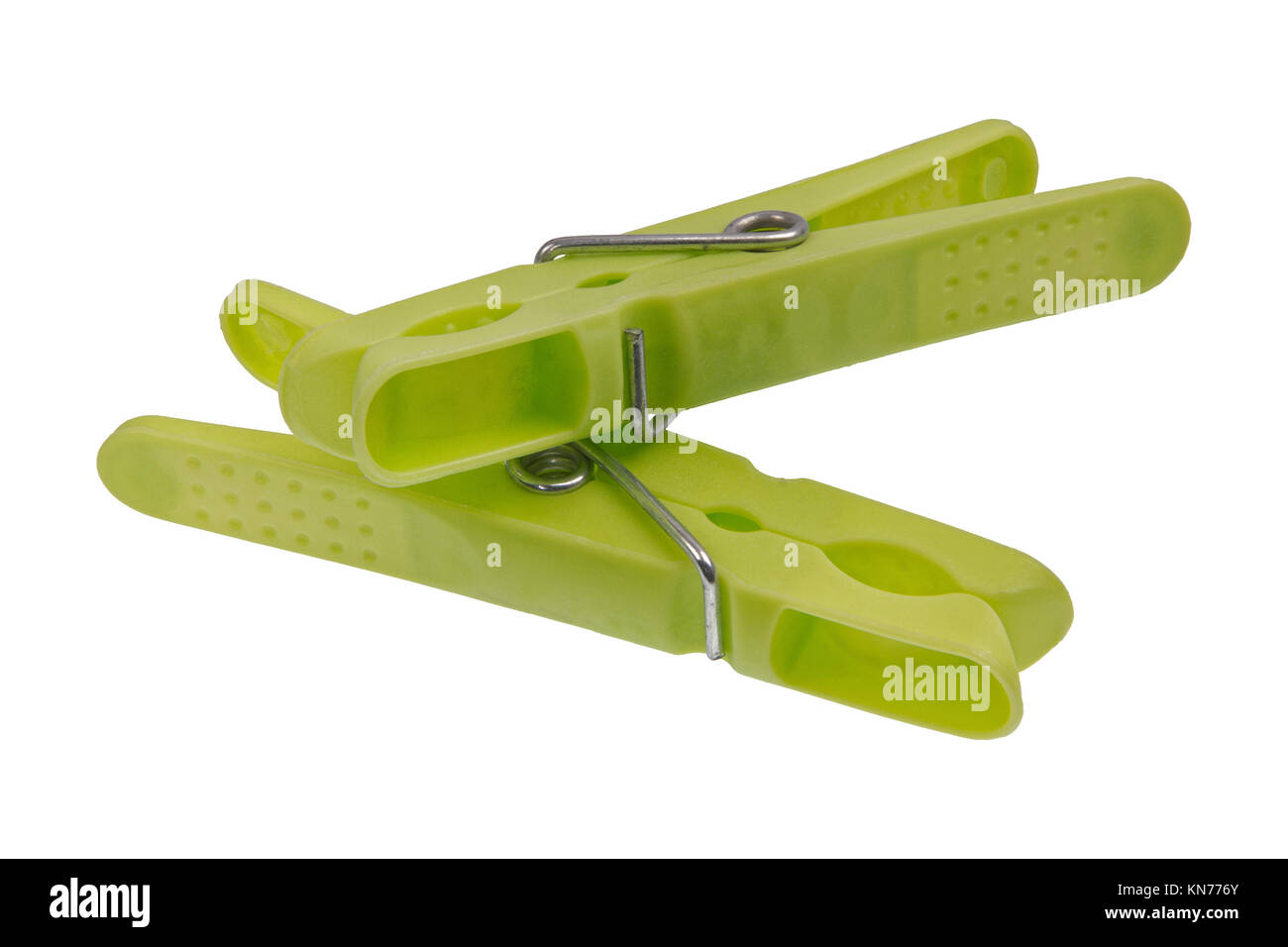 Green plastic pegs isolated on a white background Stock Photo - Alamy