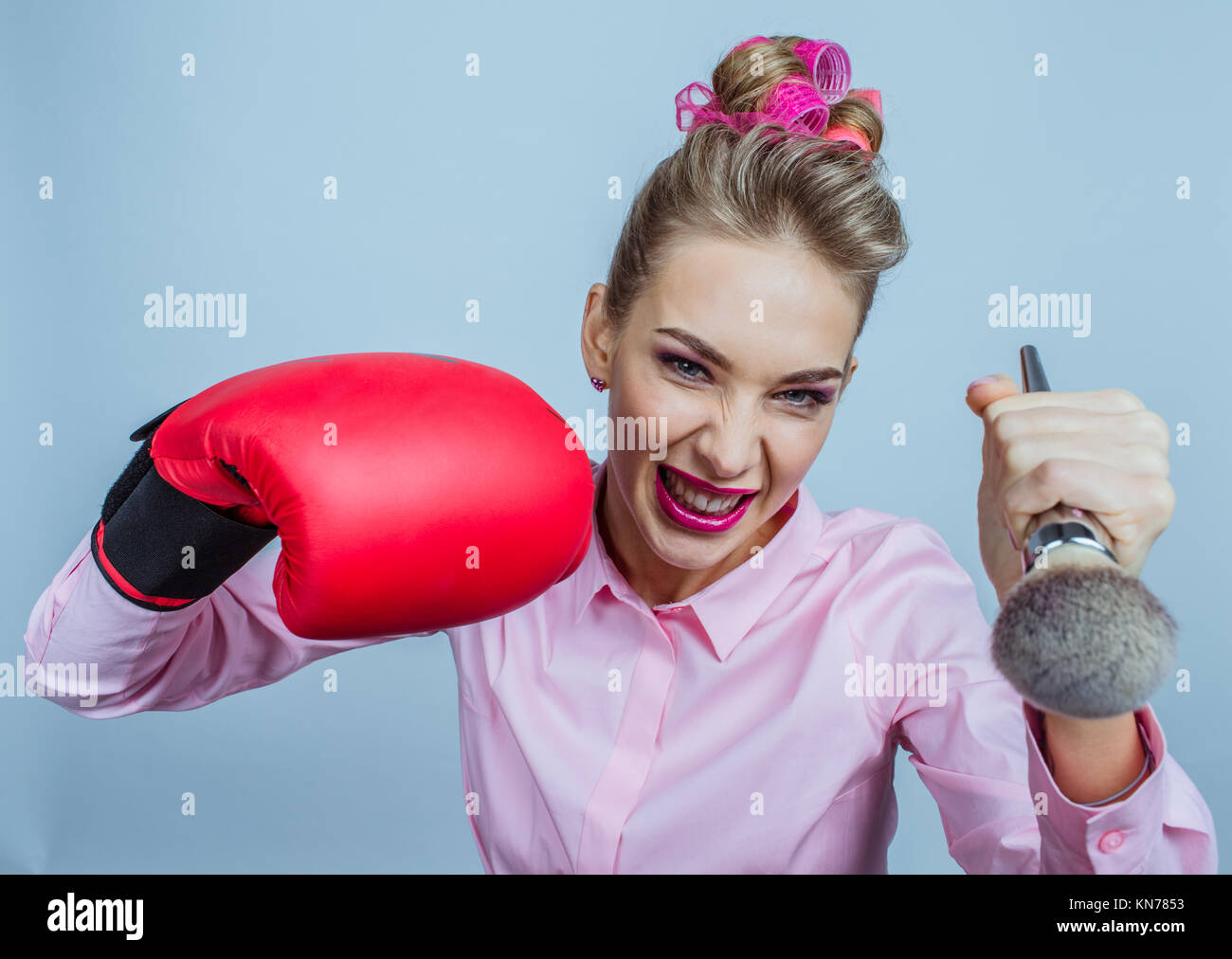 Fighting for beauty concept, funny woman with in boxing glove holding ...