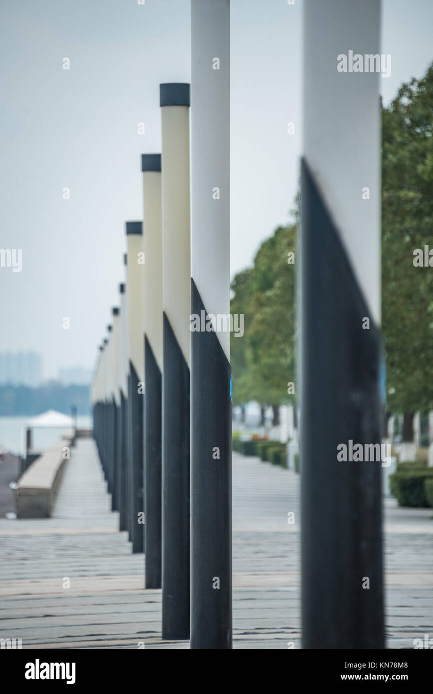 Road block pole in straight line Stock Photo - Alamy