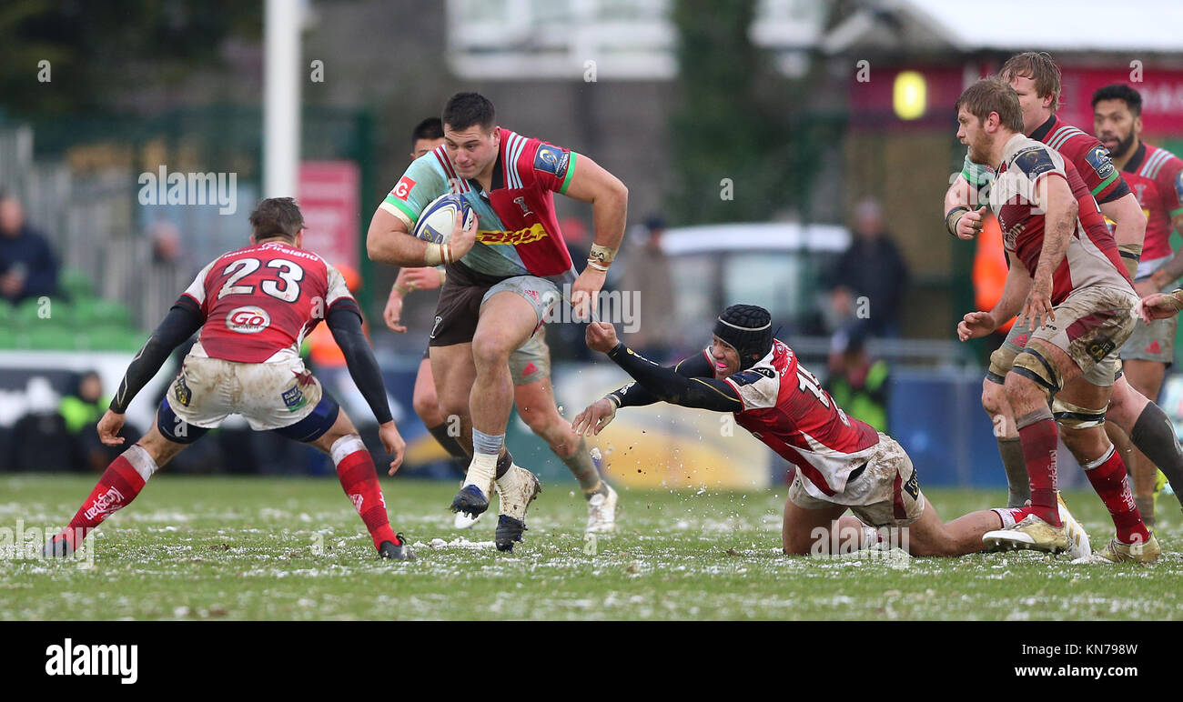 Harlequins Lewis Boyce is tackled by Ulster Rugby's Christian ...