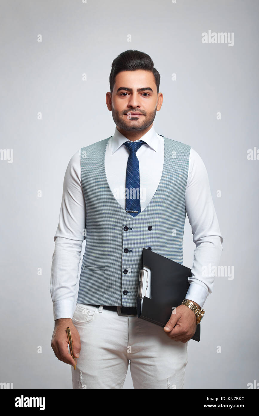 Stylish businessman at studio Stock Photo - Alamy