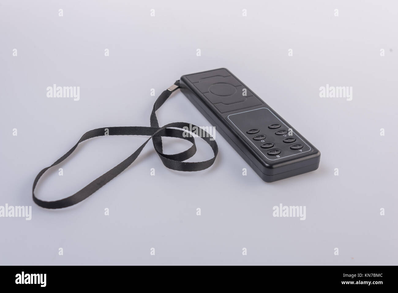 Remote control on the white table Stock Photo - Alamy