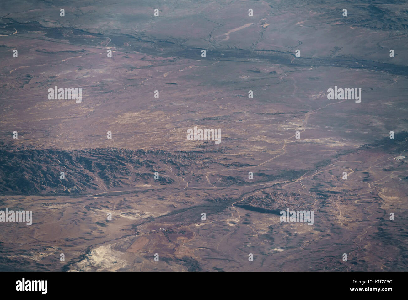 aerial shot from plane flying above the desert in daytime, uhd prores ...