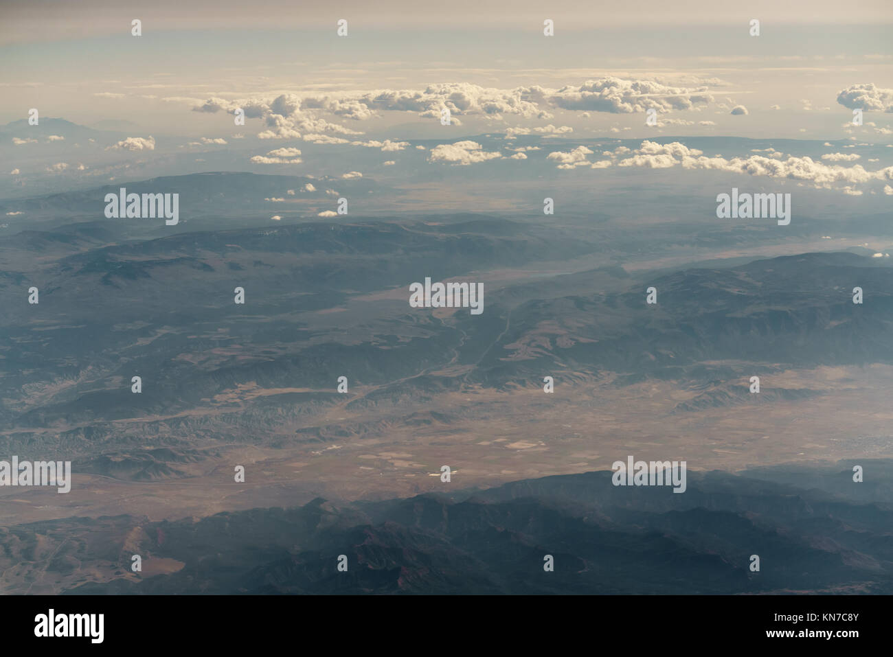 aerial shot from plane flying above the desert in daytime, uhd prores ...