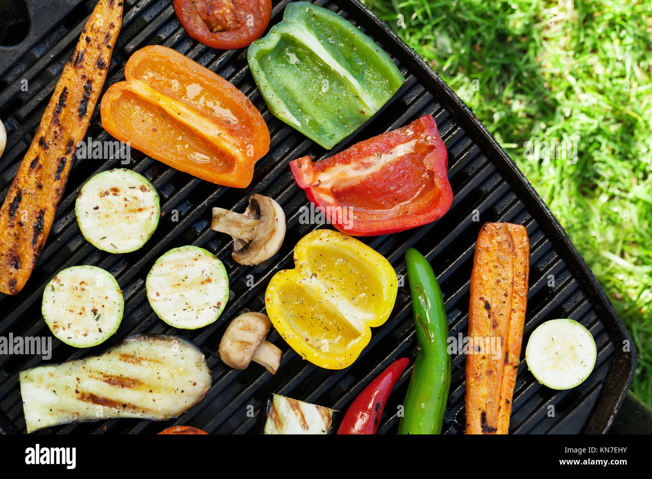 Grilled vegetables cooking. Top view Stock Photo - Alamy