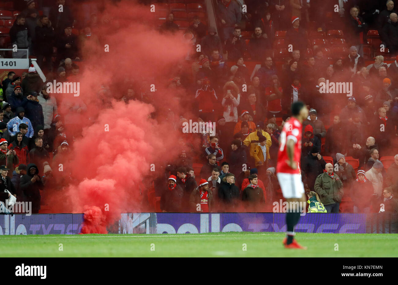 Fans set of a flare in the stands during the Premier League match at ...