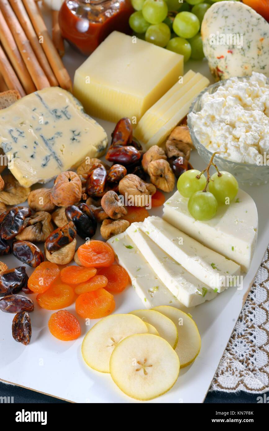 healthy types of cheese and fruits plate Stock Photo - Alamy
