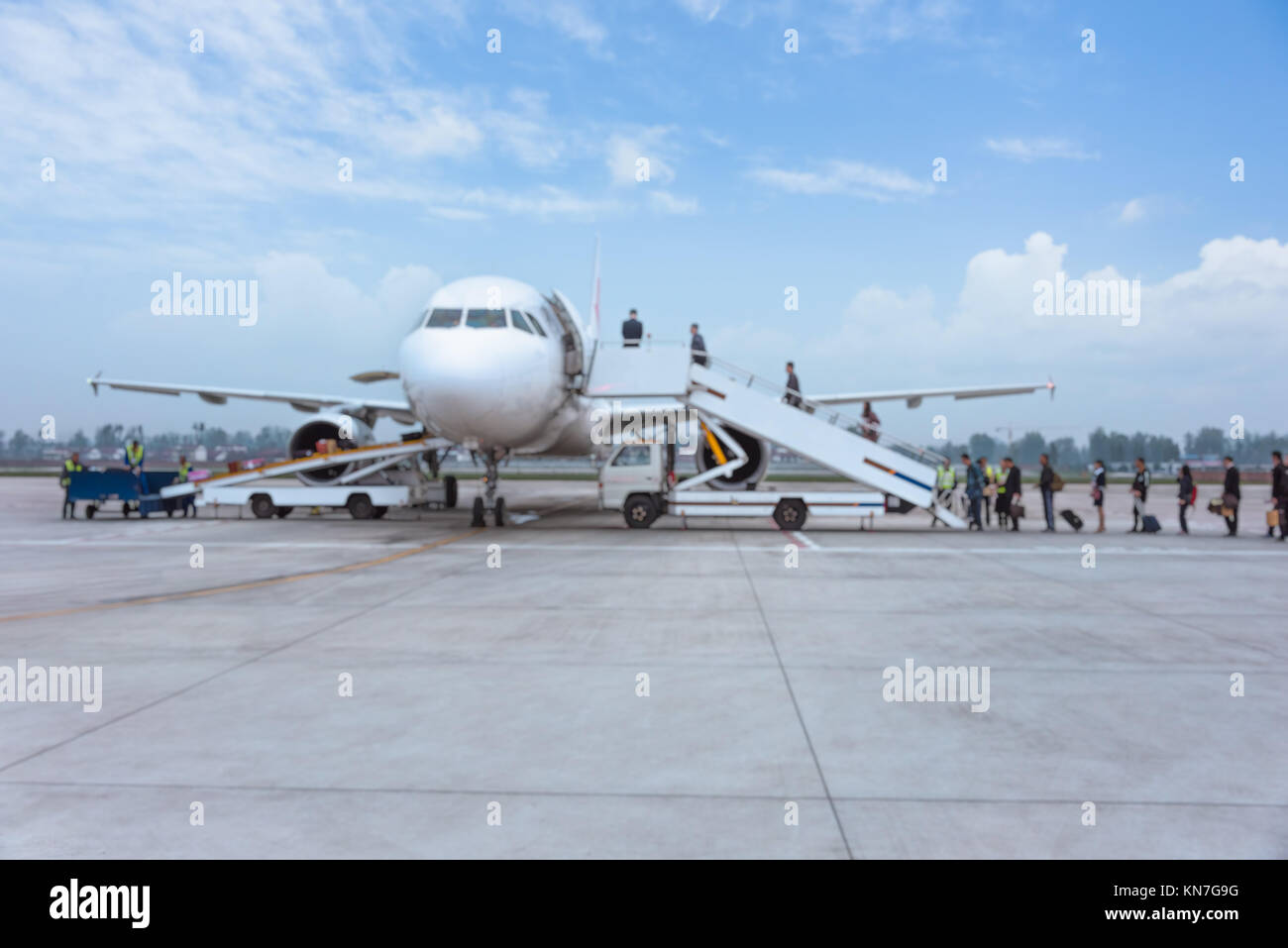 people boarding airplane on runway Stock Photo - Alamy