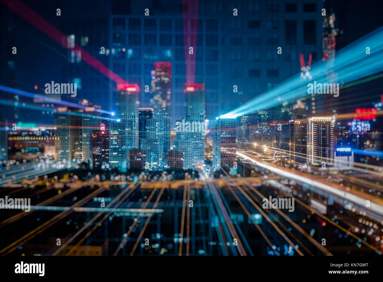 Light trails above buildings at night in China Stock Photo - Alamy