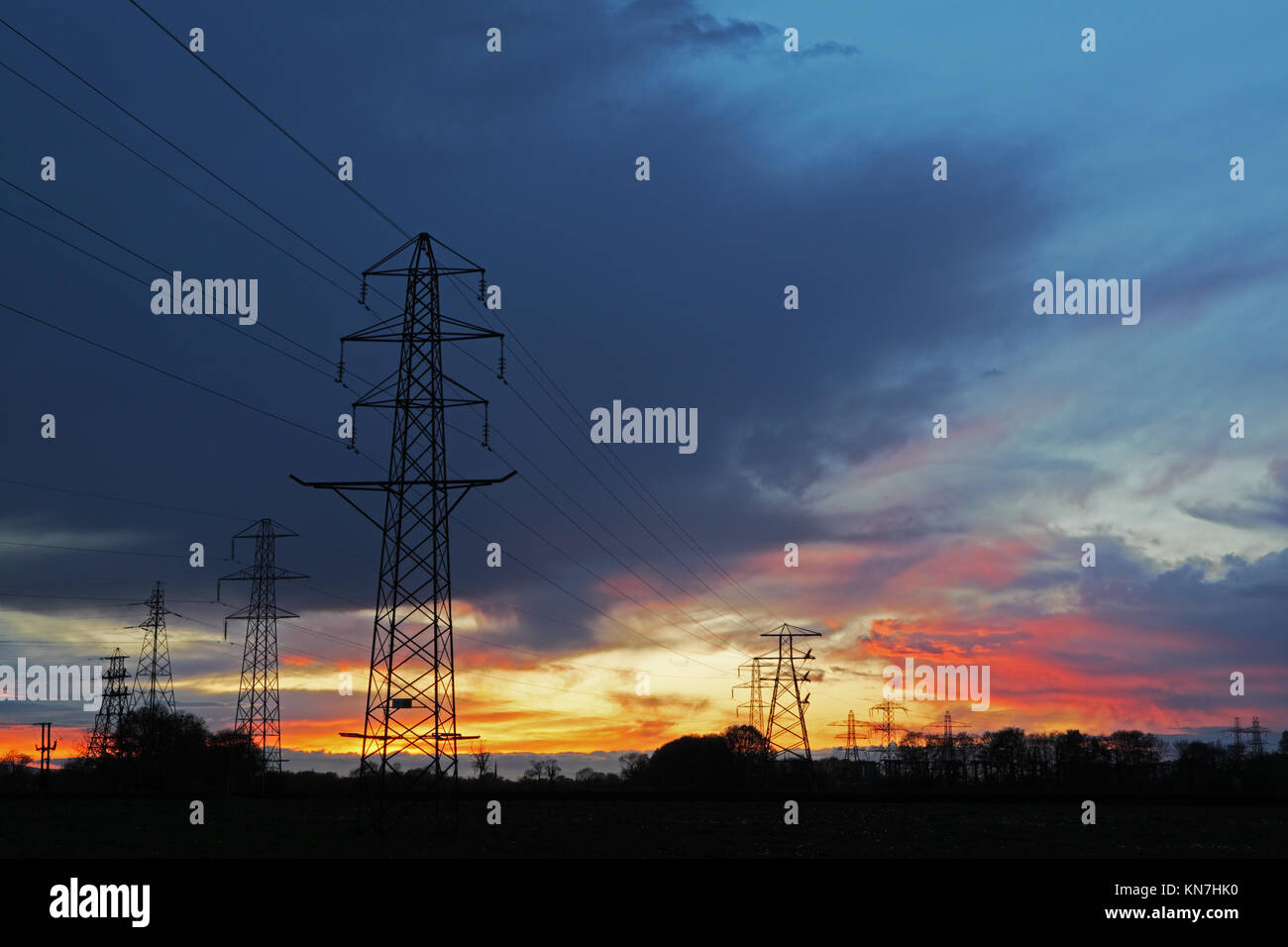 Pylons at sunset Stock Photo - Alamy