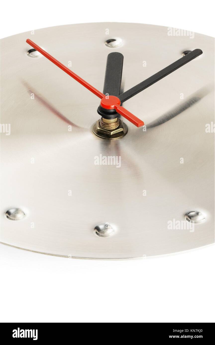 stainless steel wall clock on white background Stock Photo - Alamy