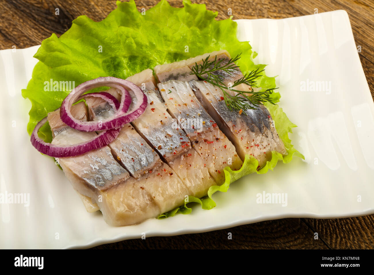 Sliced Herring fillet with dill and onion Stock Photo - Alamy