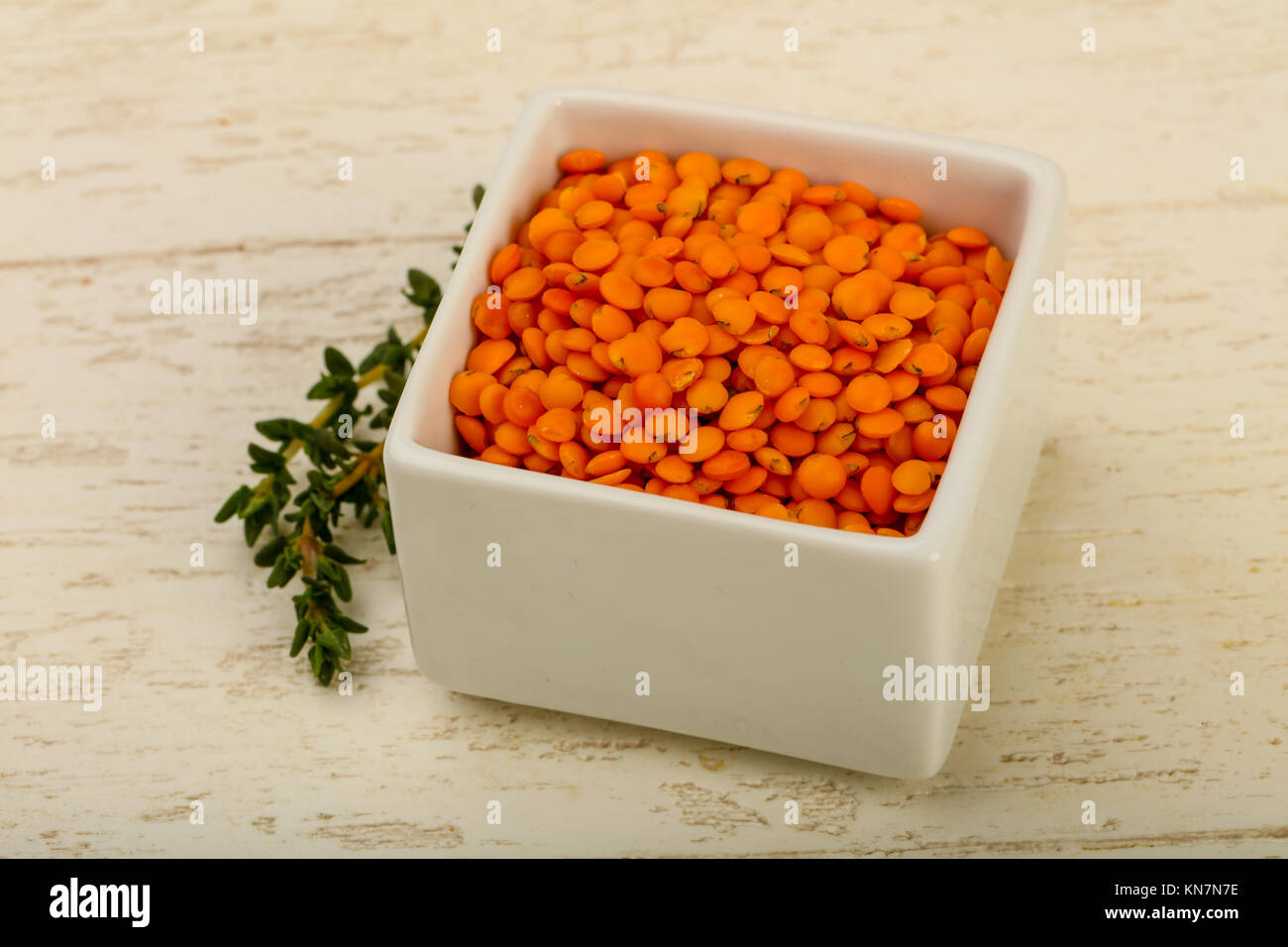 Orange lentil in the bowl over wooden background Stock Photo - Alamy