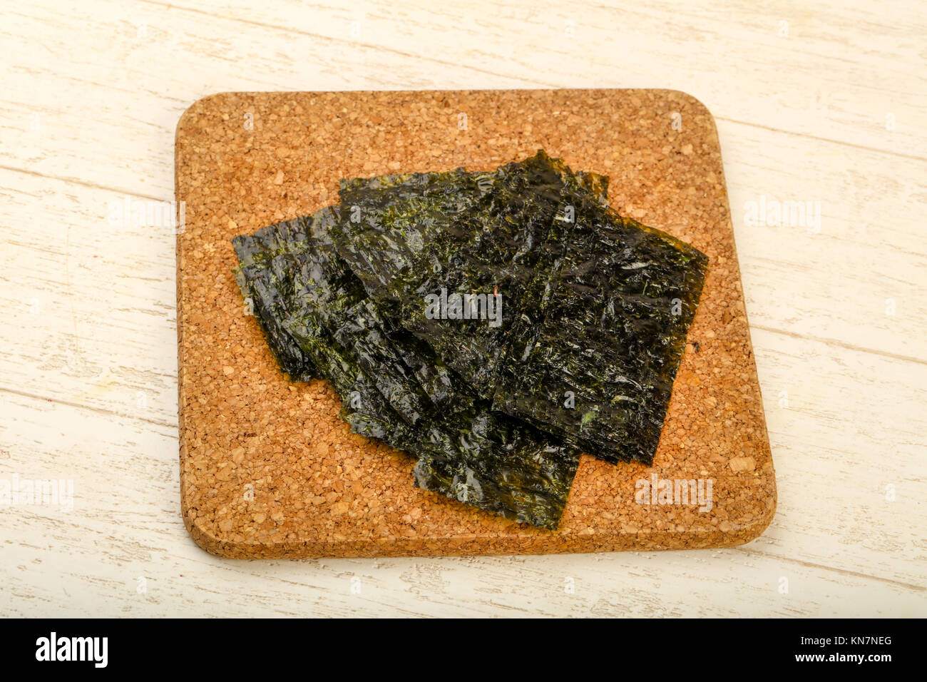 Crispy Nori sheets chips over wooden background Stock Photo - Alamy