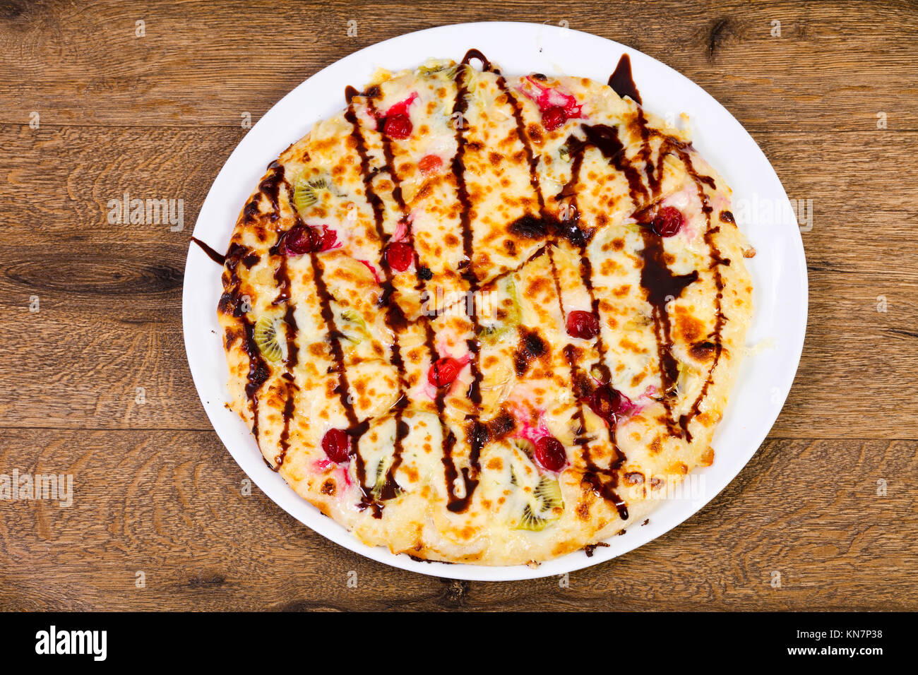 Sweet pizza with fruits and mozzarella Stock Photo - Alamy