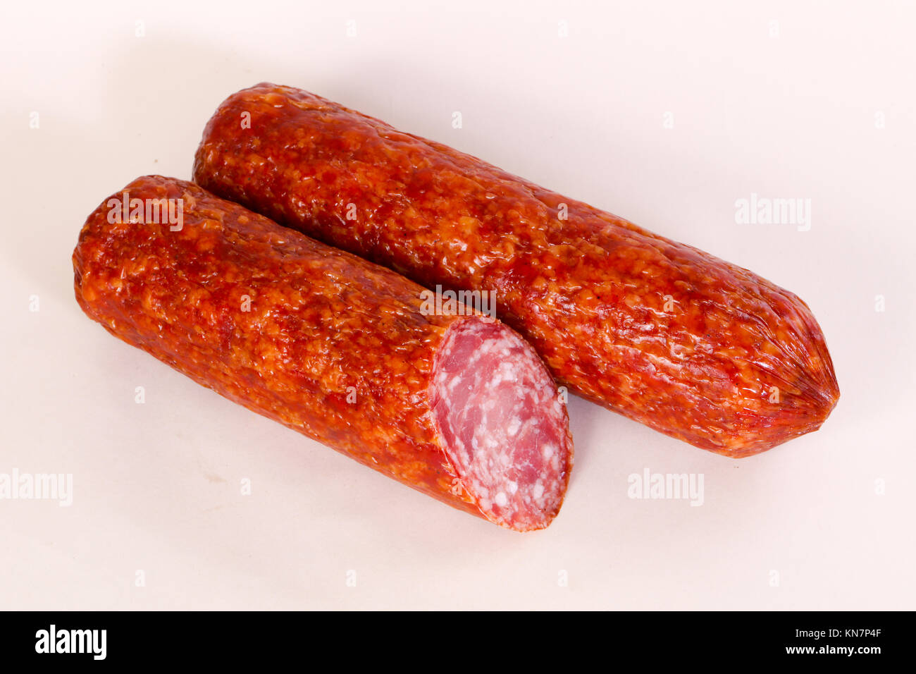 Dry salamy sausage isolated Stock Photo - Alamy