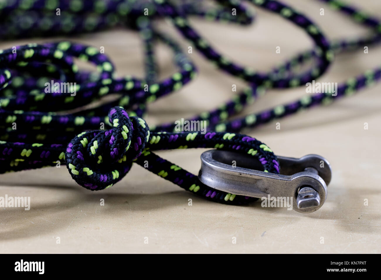 Rigging, sailing accessories. Rope block and shekel on a wooden table ...