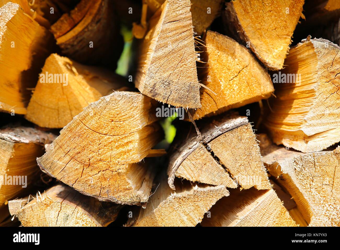 Stacked up fire wood background Stock Photo - Alamy