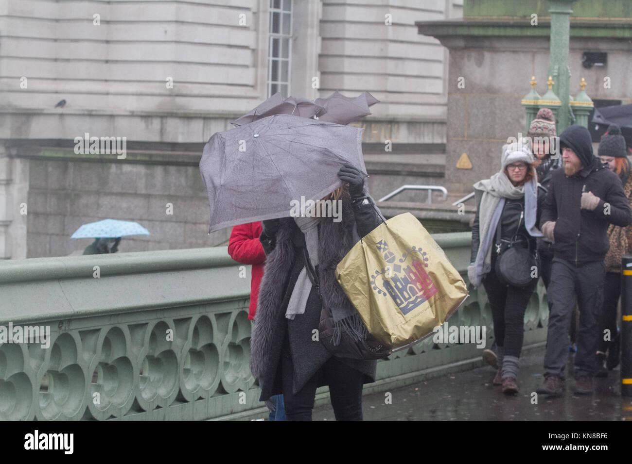 London, UK. 11th Dec, 2017. Pedestrians brave the cold weather with ...
