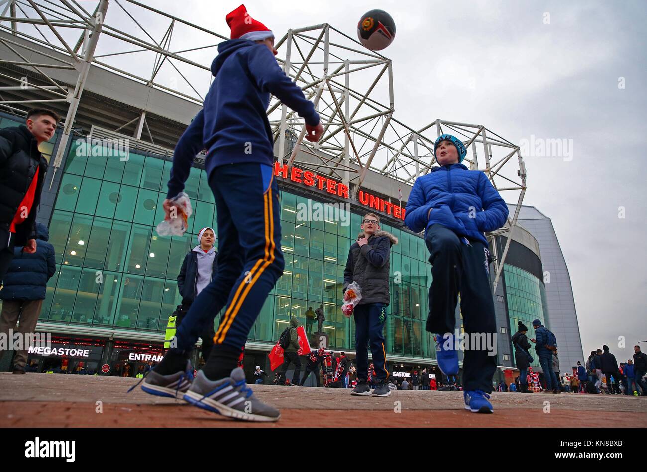 Manchester, UK. 10th December, 2017. KIDS PLAYING FOOTBALL OUTSIDE OLD ...