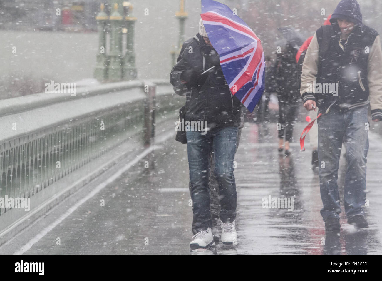 London, UK. 11th Dec, 2017. Pedestrians struggle to cope with the ...