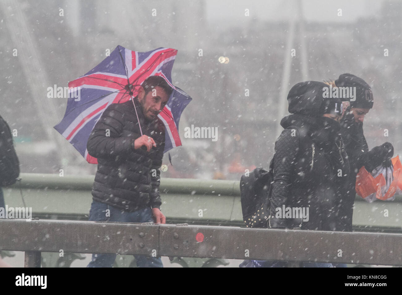 London, UK. 11th Dec, 2017. Pedestrians struggle to cope with the ...