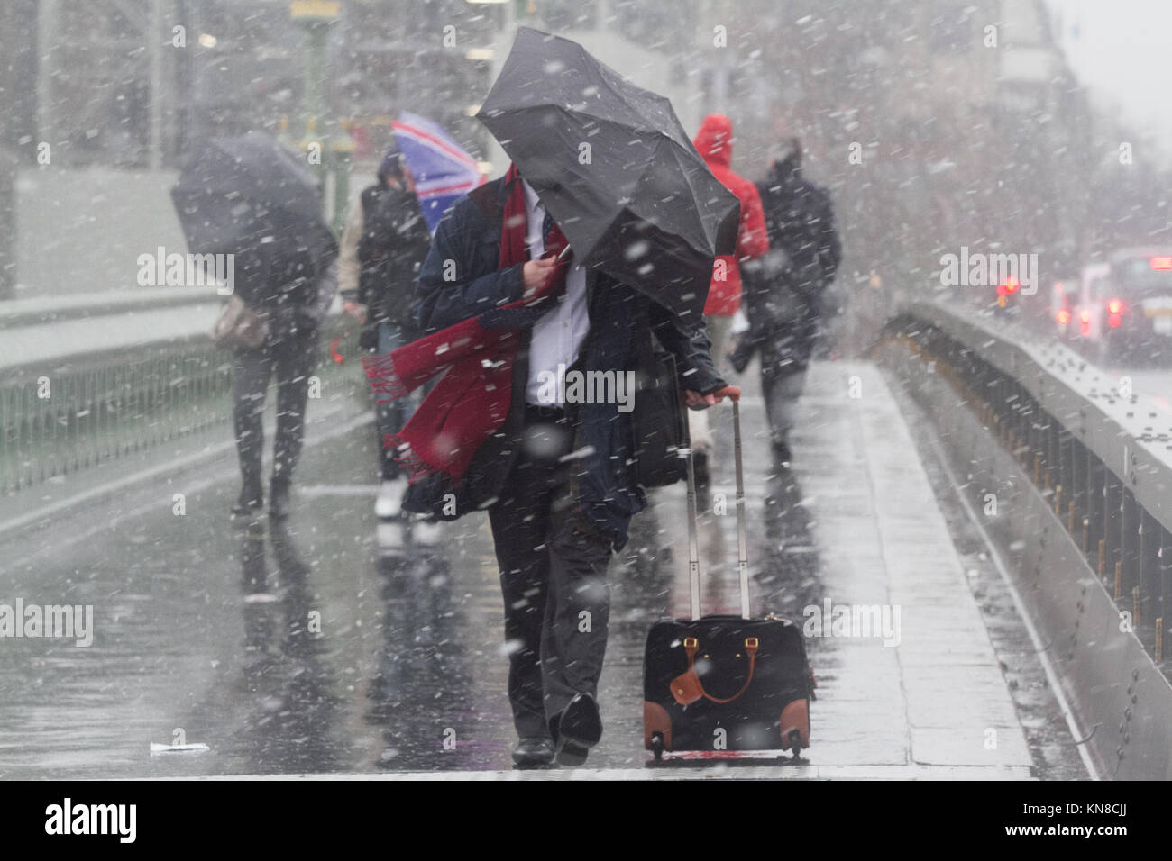 London, UK. 11th Dec, 2017. Pedestrians struggle to cope with the ...