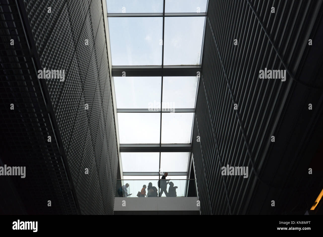 people walking through a modern office building Stock Photo - Alamy