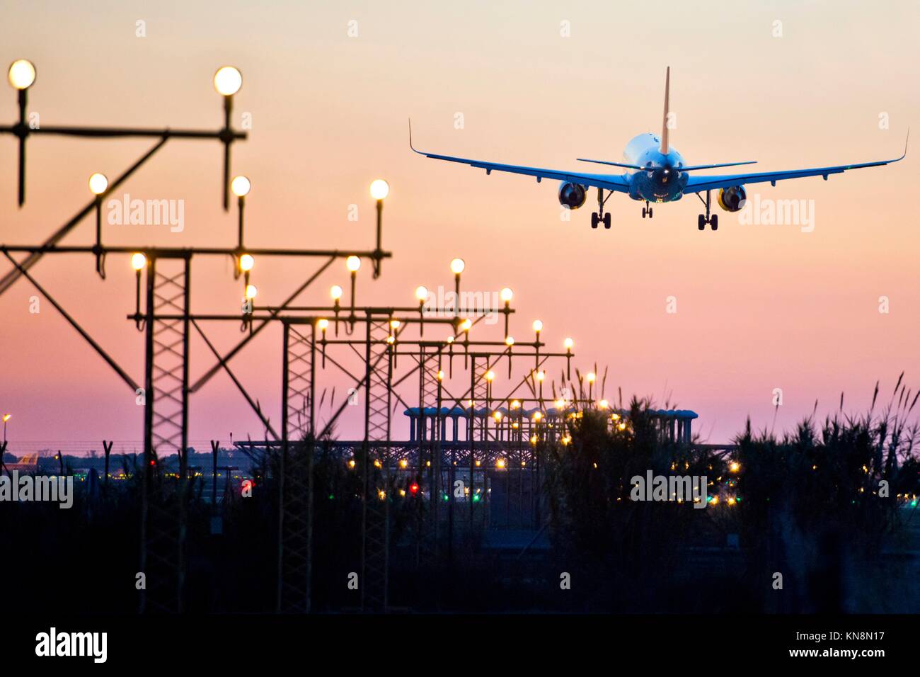 Image plane in sunset sky hi-res stock photography and images - Alamy