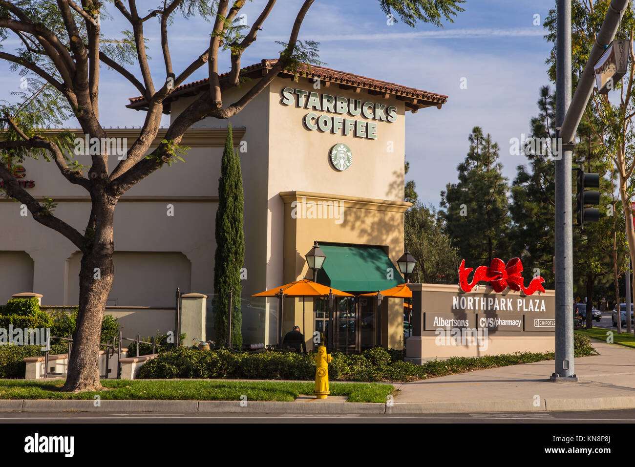 A street level view of the exterior of a Starbucks cofee shop in Irvine ...