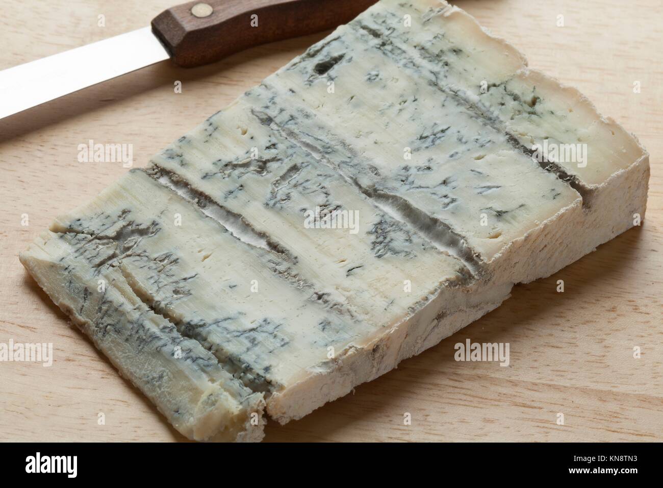 Piece of blue Gorganzola cheese Stock Photo - Alamy
