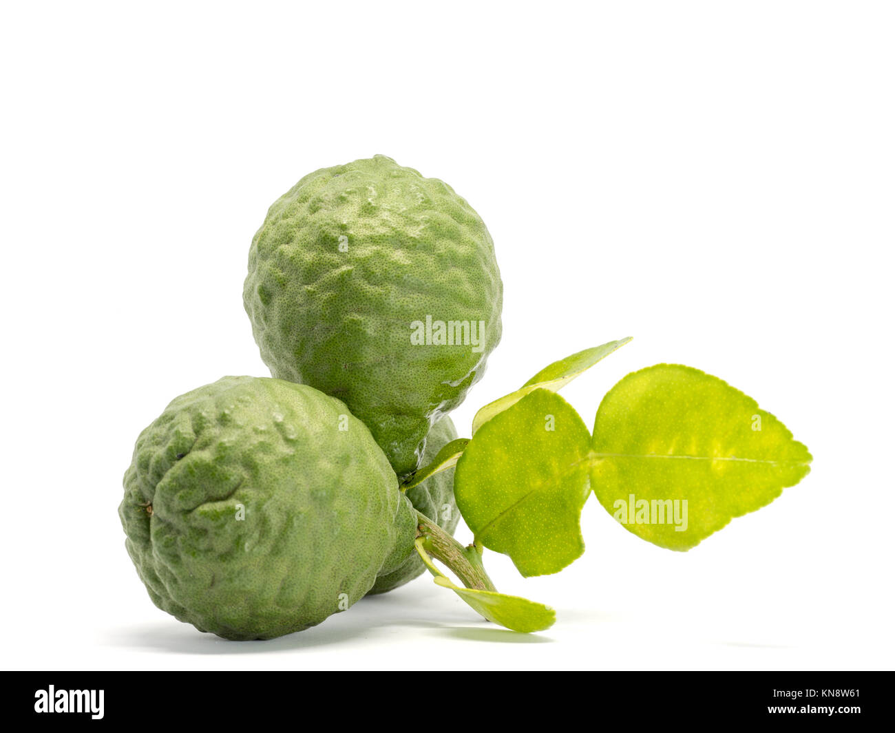 close up group of fresh bergamot with green leaves isolated on white ...