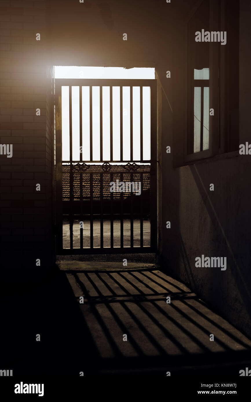 Closed Metallic Gate with shadow Stock Photo - Alamy