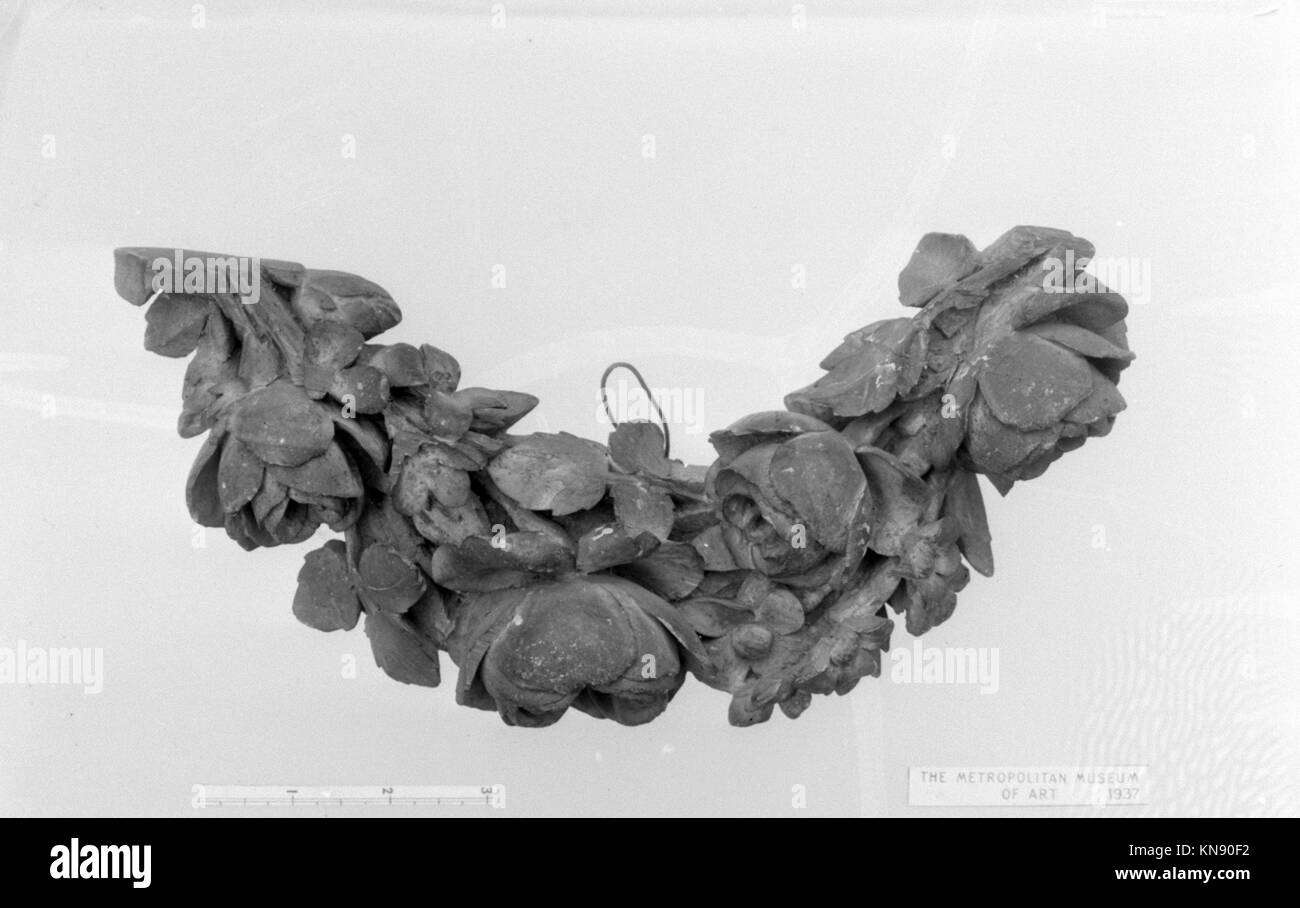 This 18th-century French garland, crafted from wood and gilt, is part ...