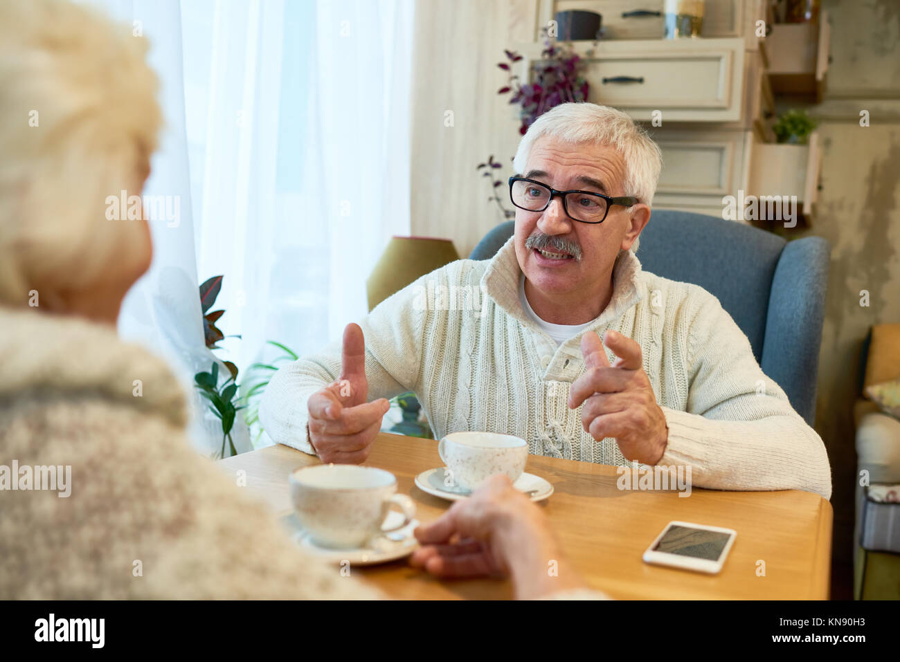 Senior couple enjoying tea hi-res stock photography and images - Alamy
