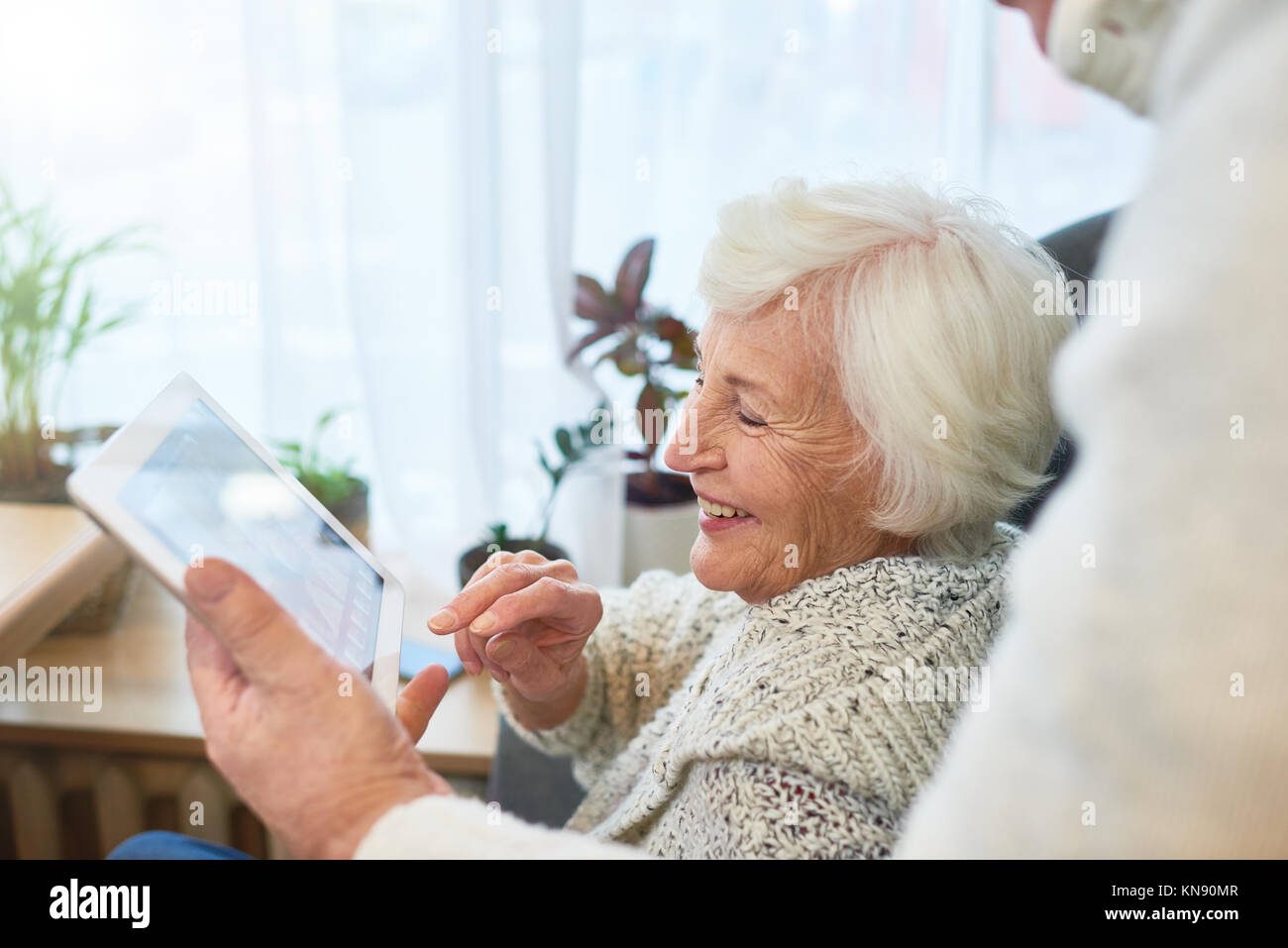 Old elegant lady tablet hi-res stock photography and images - Alamy