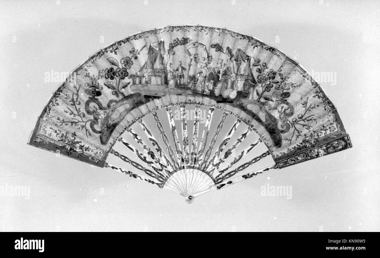 This fan is a delicate decorative object, featuring intricate design ...
