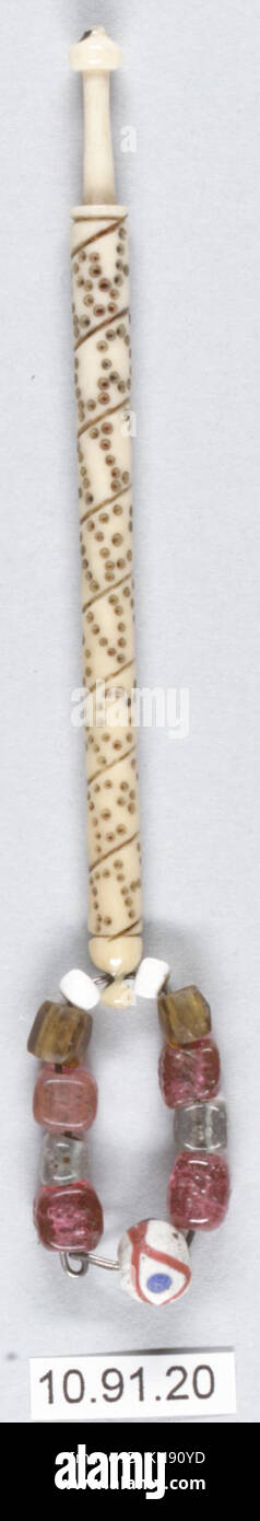 This bobbin is an example of historical textile tools, used for lace ...