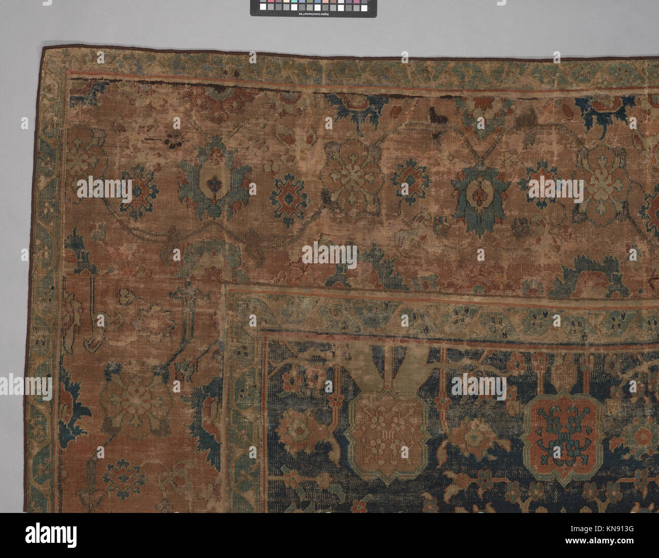 This carpet features a repeating tree design, typical of intricate ...