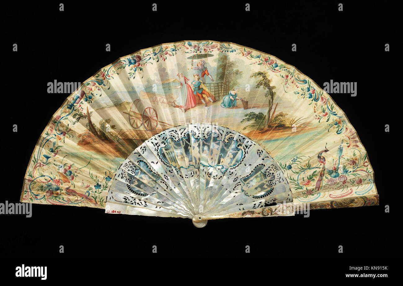 This fan features intricate craftsmanship, showcasing an ornamental ...