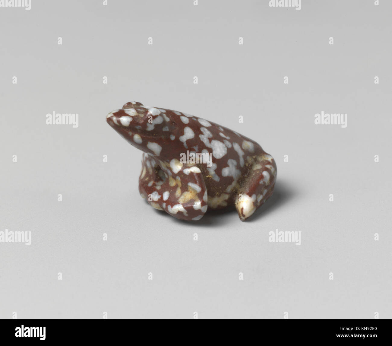 This ancient frog amulet is made of durable material and represents a ...