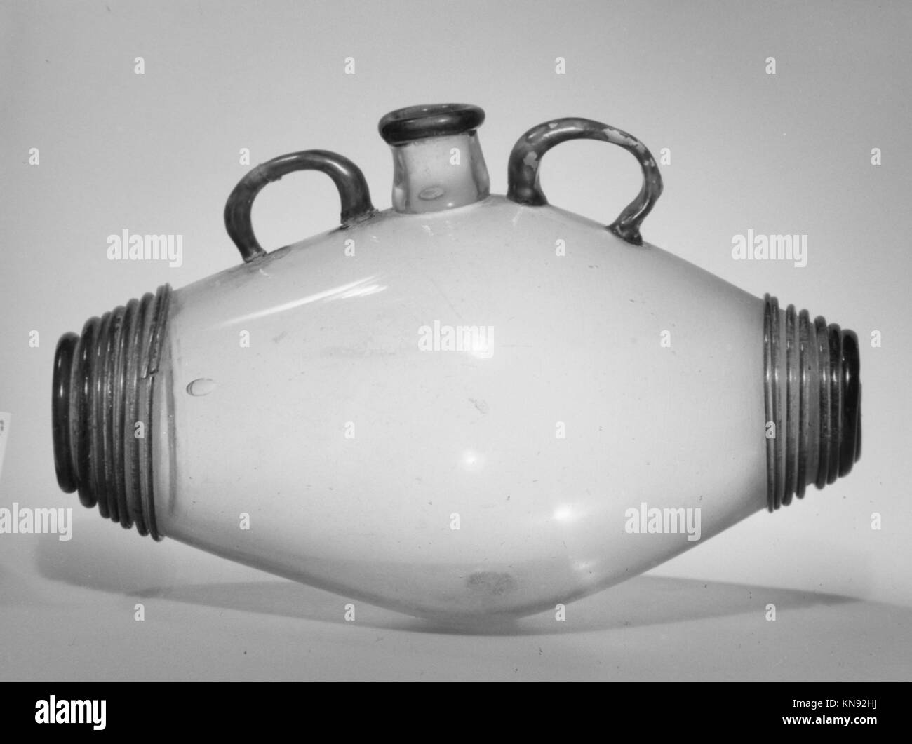 Glass flask demonstrating utilitarian design and artistic craftsmanship ...